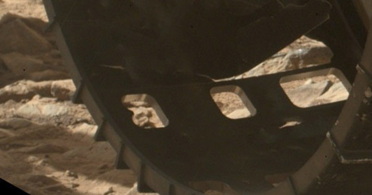 Detail view of Curiosity's left front wheel,… | The Planetary Society