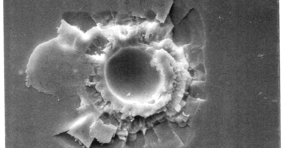 Hubble solar array impact crater | The Planetary Society