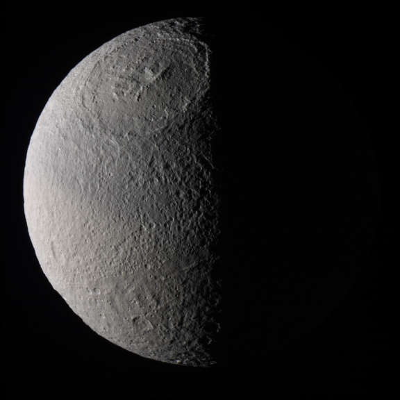 Global color view of a half-phase Tethys,… | The Planetary Society