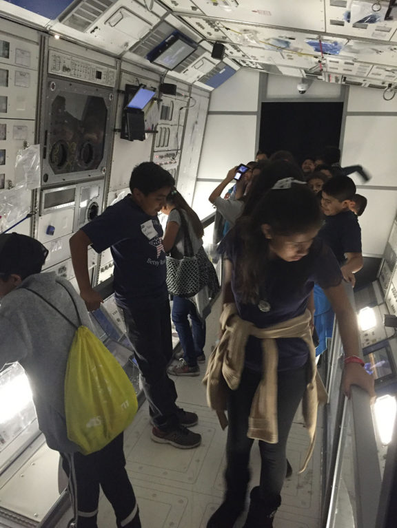 Kids in rotating ISS Destiny module mock-up… | The Planetary Society