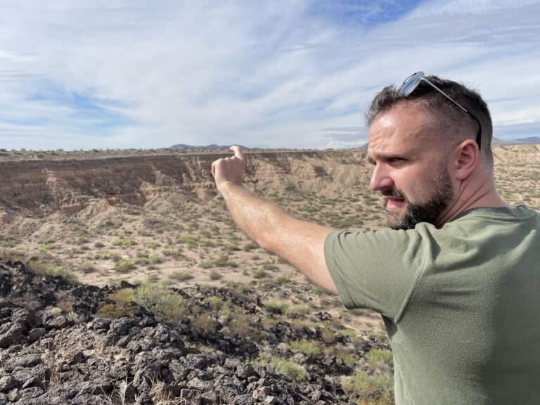 Kirby Runyon points at the wall of Kilbourne… | The Planetary Society